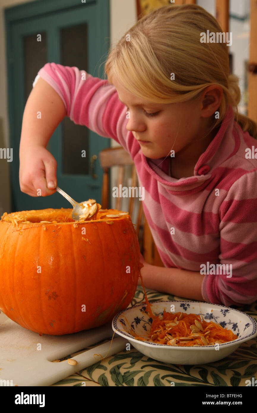 Preparing pumpkin halloween scooping out hi-res stock photography and ...