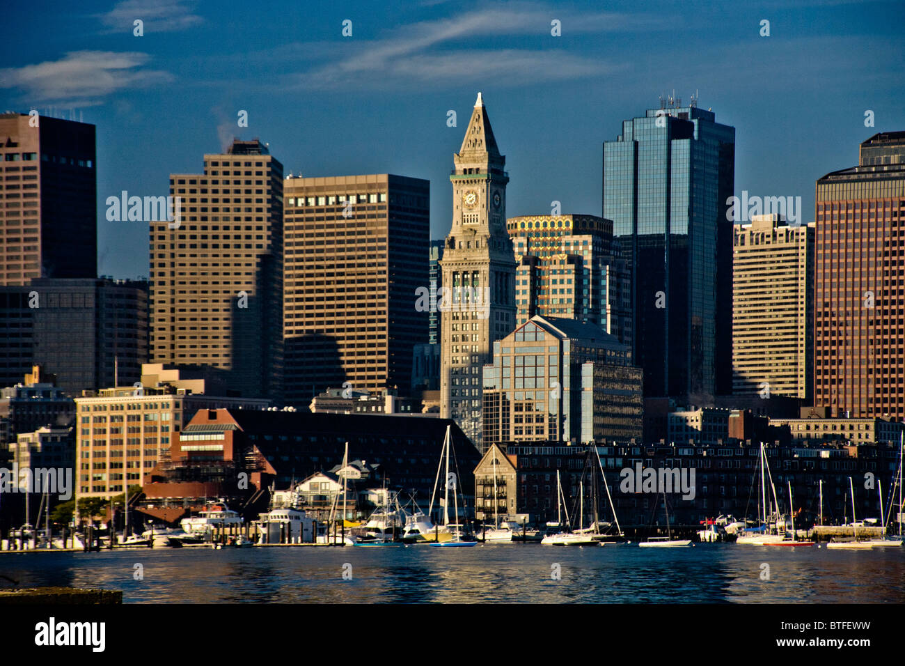 Morning sun shines on the downtown Boston harbor skyline as seen from ...