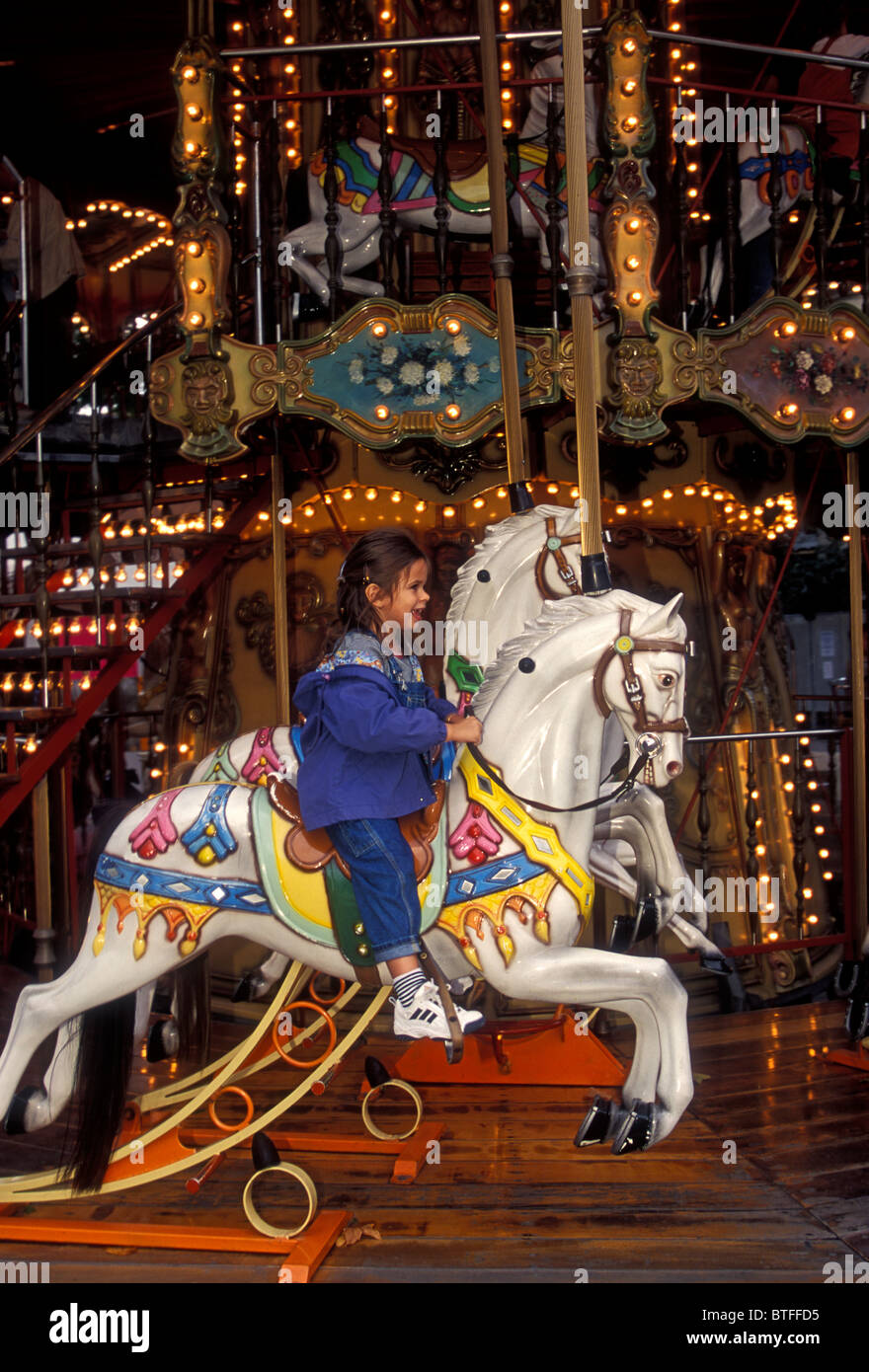 French girl, liitle girl, young girl, riding carousel, carousel, merry ...