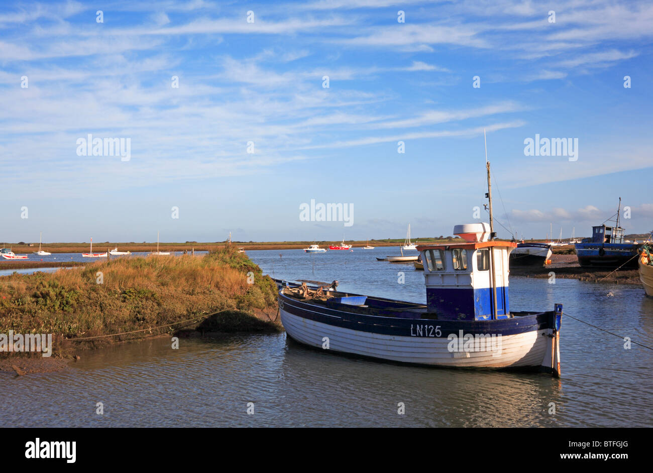 Small commercial inshore fishing boat in harbour at Brancaster Staithe ...
