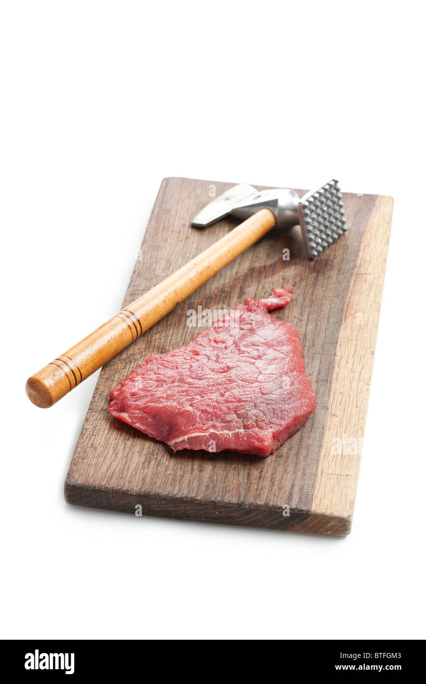 beef steak with meat mallet on white background Stock Photo - Alamy