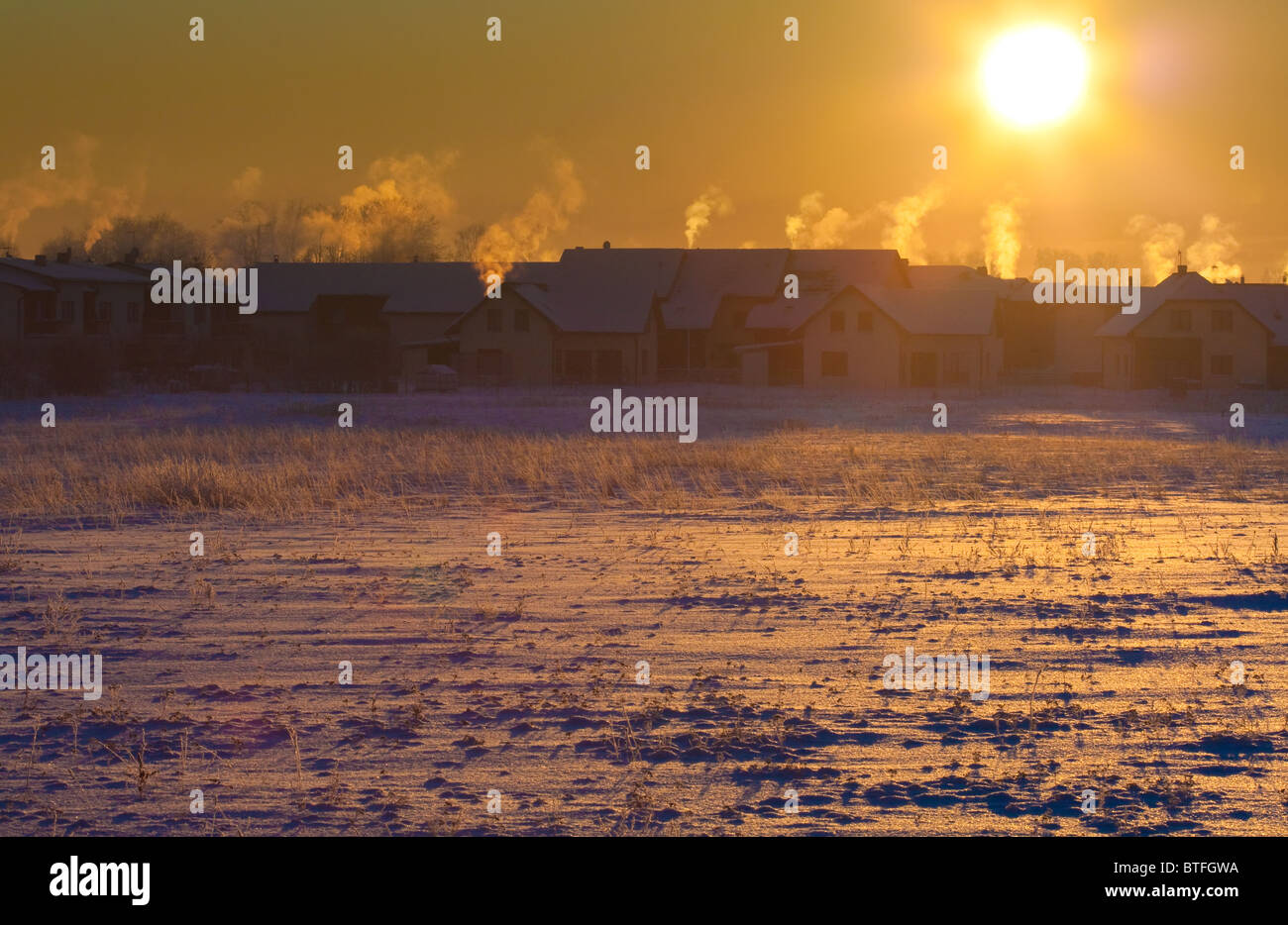 Smoke from multiple houses in cold winter Stock Photo - Alamy