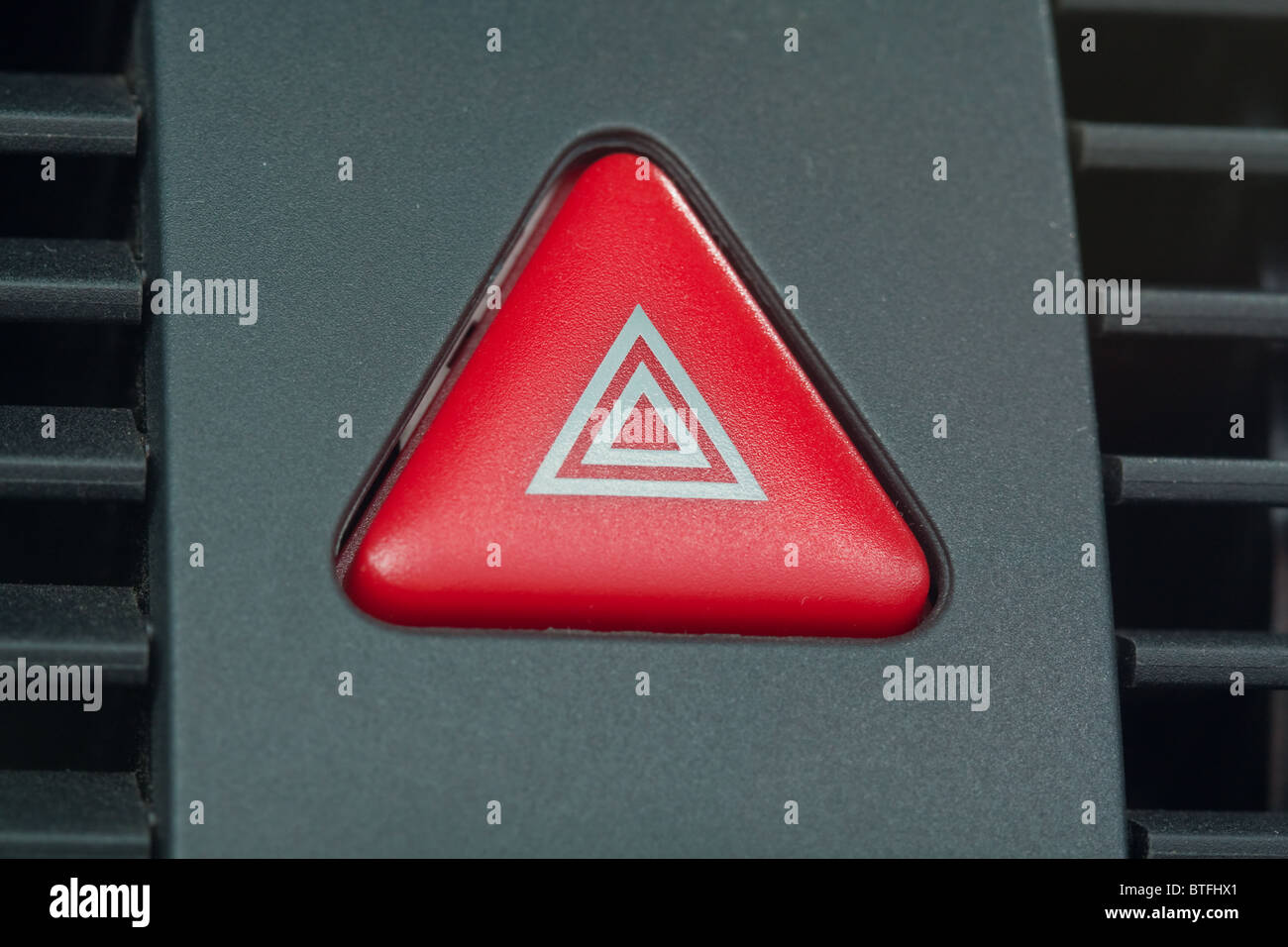 Emergency button on car panel Stock Photo - Alamy