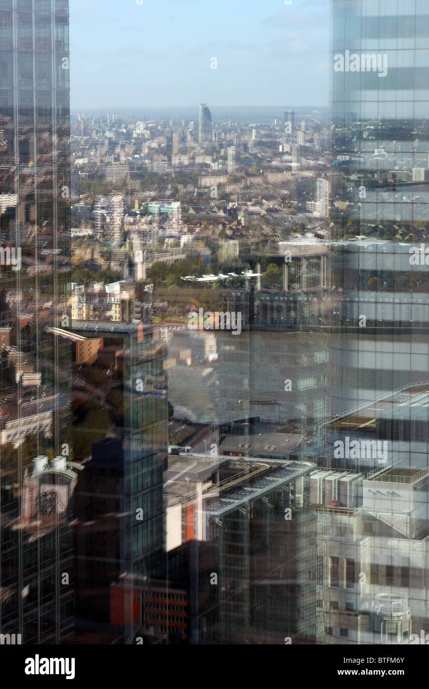 Reflections of London and Canary Wharf buildings as seen in and through ...