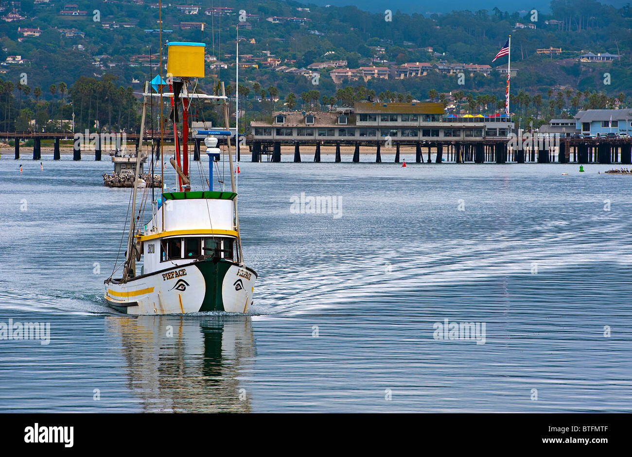 Fishing boat enters the Santa Barbara harbor Stock Photo - Alamy
