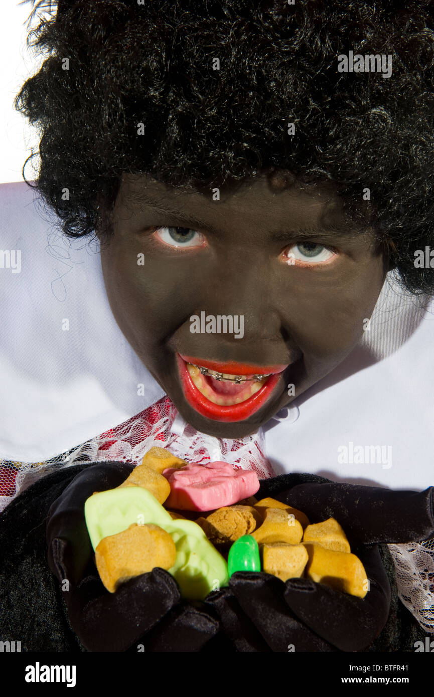 Dutch Black Piet is eating his own pepernoten Stock Photo - Alamy