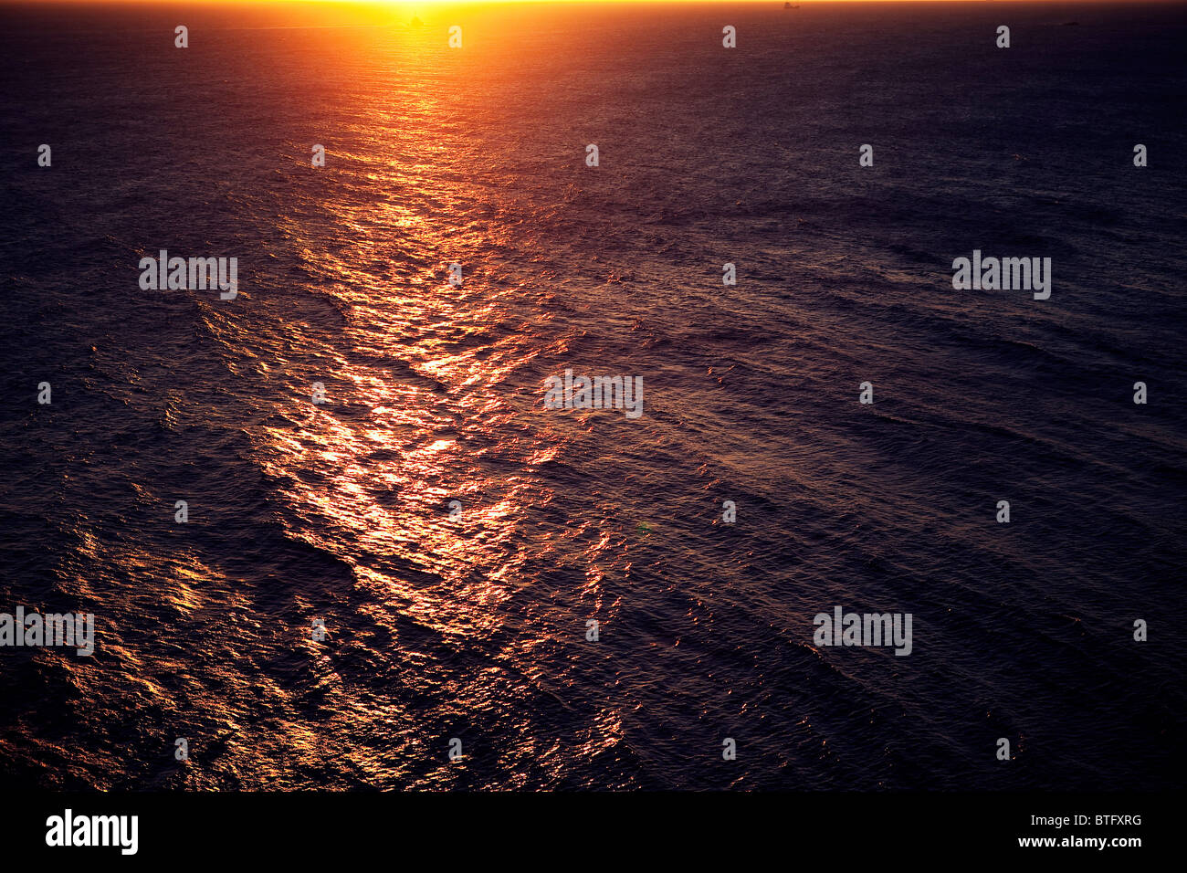 Sunset over water ocean hi-res stock photography and images - Alamy