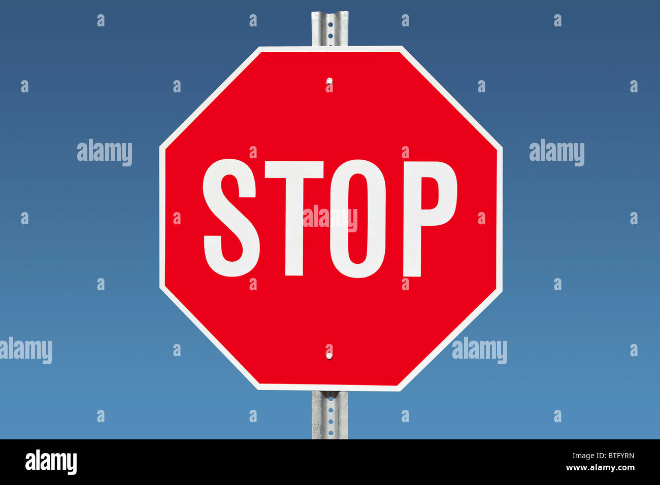 Blank stop sign on a gradient blue sky Stock Photo - Alamy