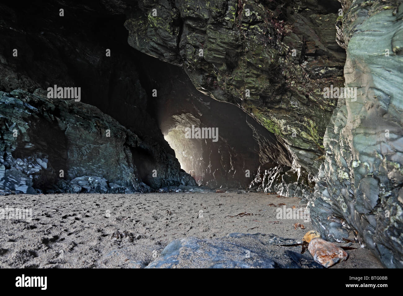 Merlins Cave Below Tintagel Castle Cornwall South West England UK Stock ...