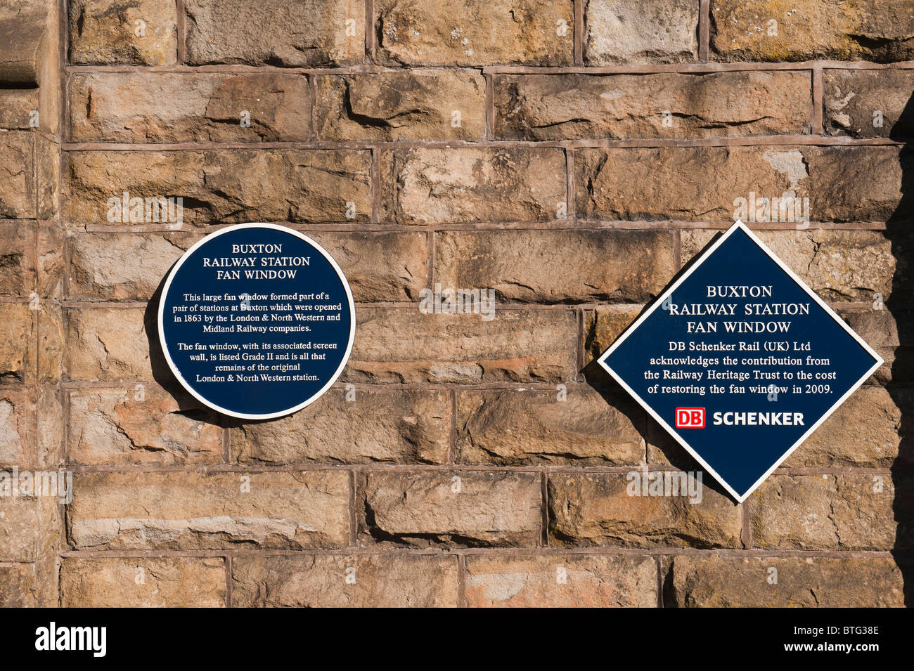 The signs beneath the Buxton Railway Station Fan Window Stock Photo - Alamy