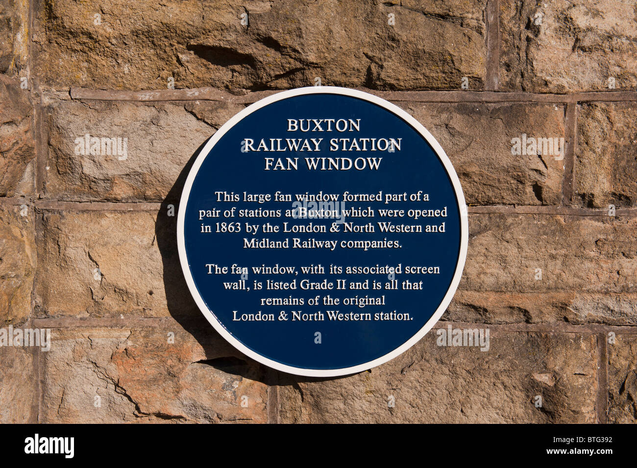A sign beneath the Buxton Railway Station Fan Window Stock Photo - Alamy