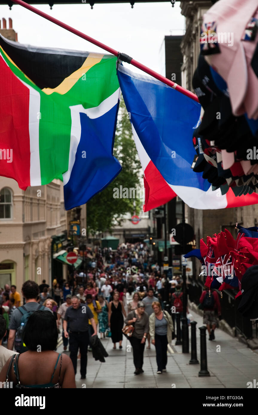 Colourful flags on a crowded London street Stock Photo - Alamy