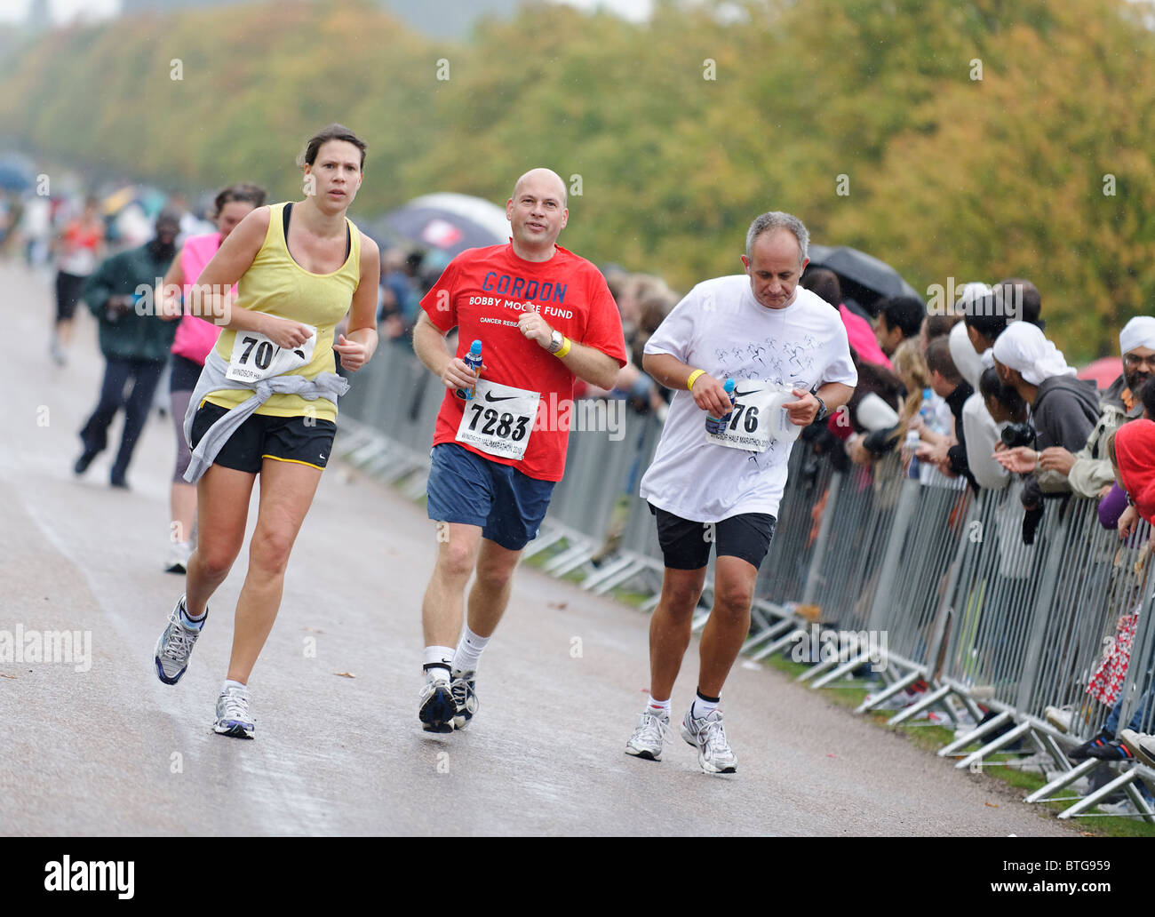 Runners in the rain at the Windsor Great Park half marathon in England ...