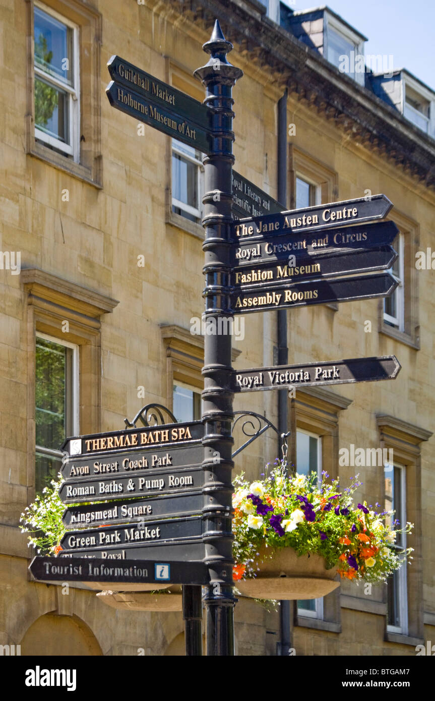 Vertical close up of an old fashioned wrought iron sign post in the ...