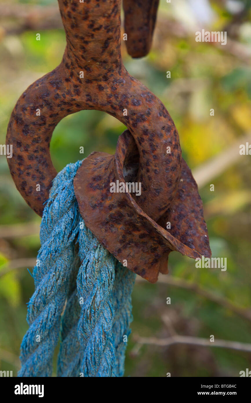 Rusty eye bolt on a boat winch with standard blue rope Stock Photo - Alamy