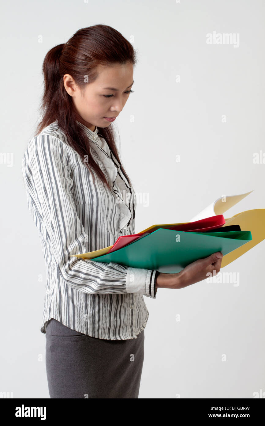 Office lady with files Stock Photo - Alamy