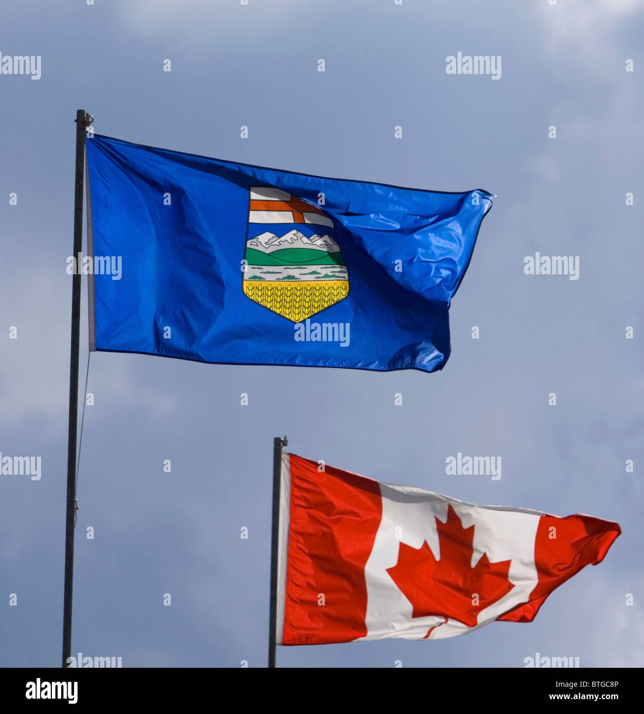 Alberta and Canadian flag flapping in the wind Stock Photo - Alamy