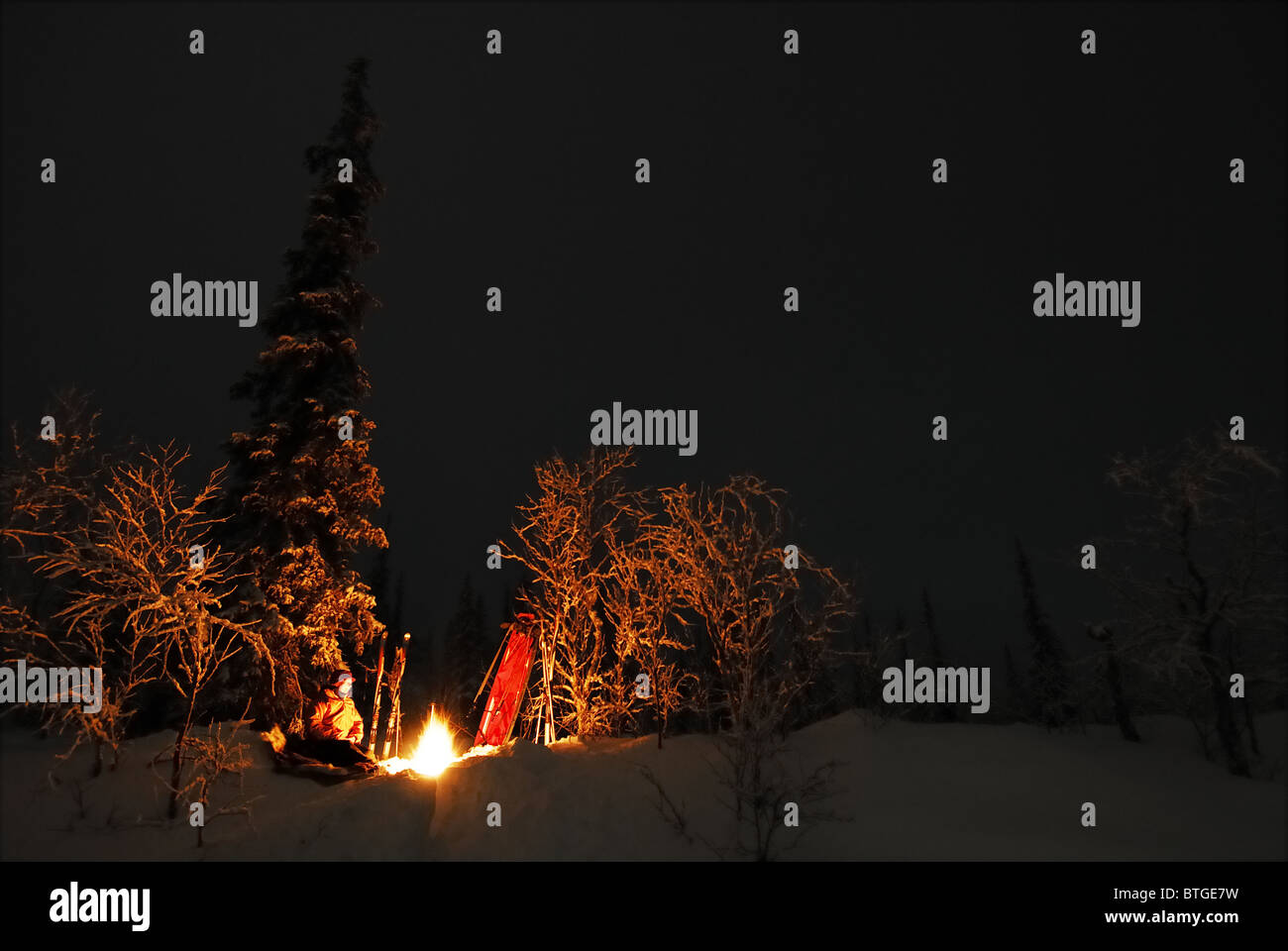 Resting at campfire Stock Photo - Alamy