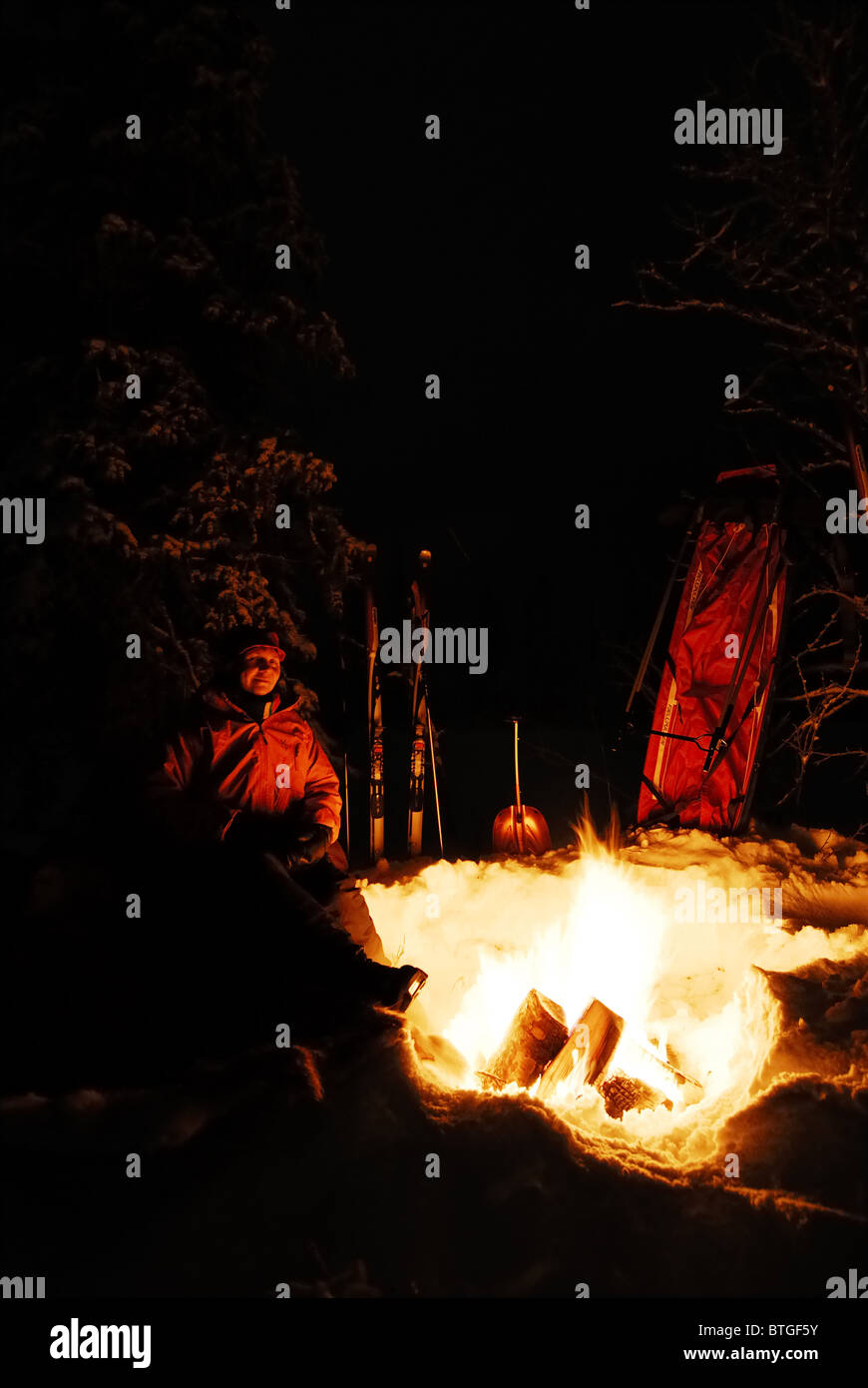 Resting at campfire Stock Photo - Alamy