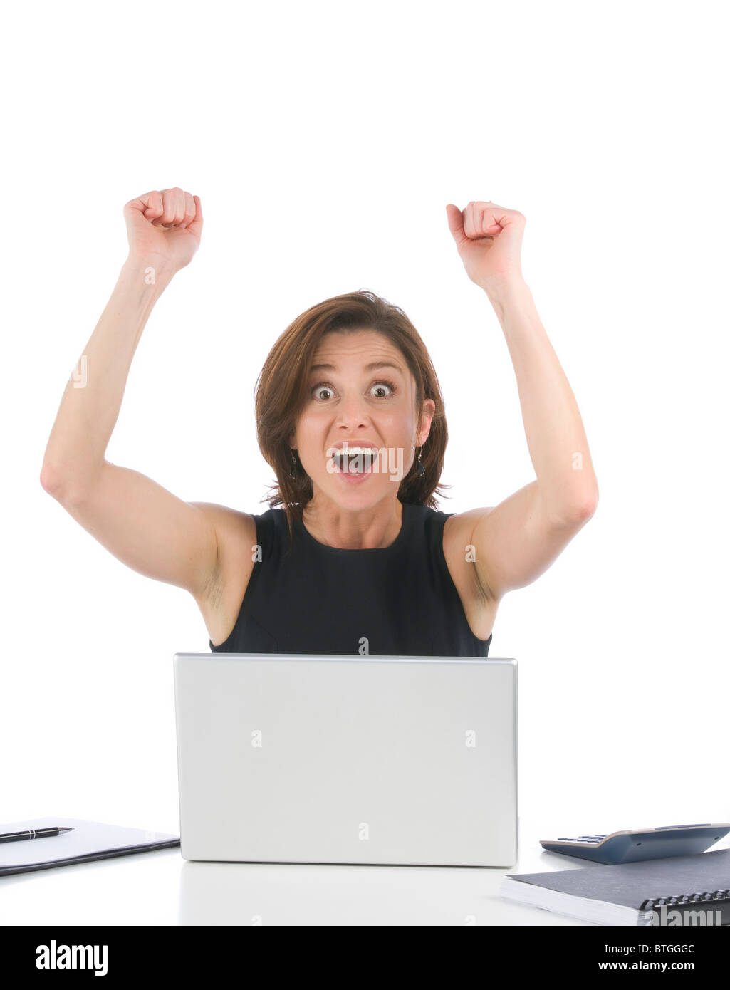 Beautiful businesswoman in her office exulting Stock Photo - Alamy