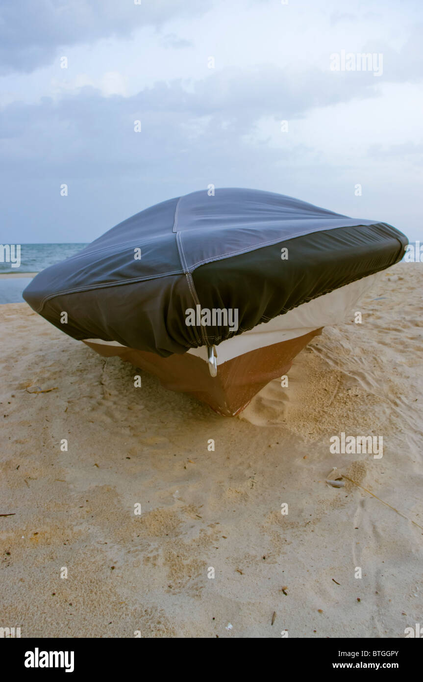 Covered boat on the beach hi-res stock photography and images - Alamy