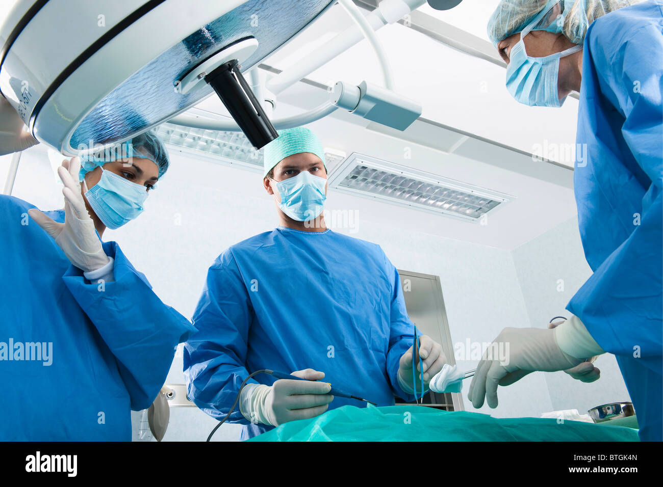 Medical personnel in operating room Stock Photo - Alamy