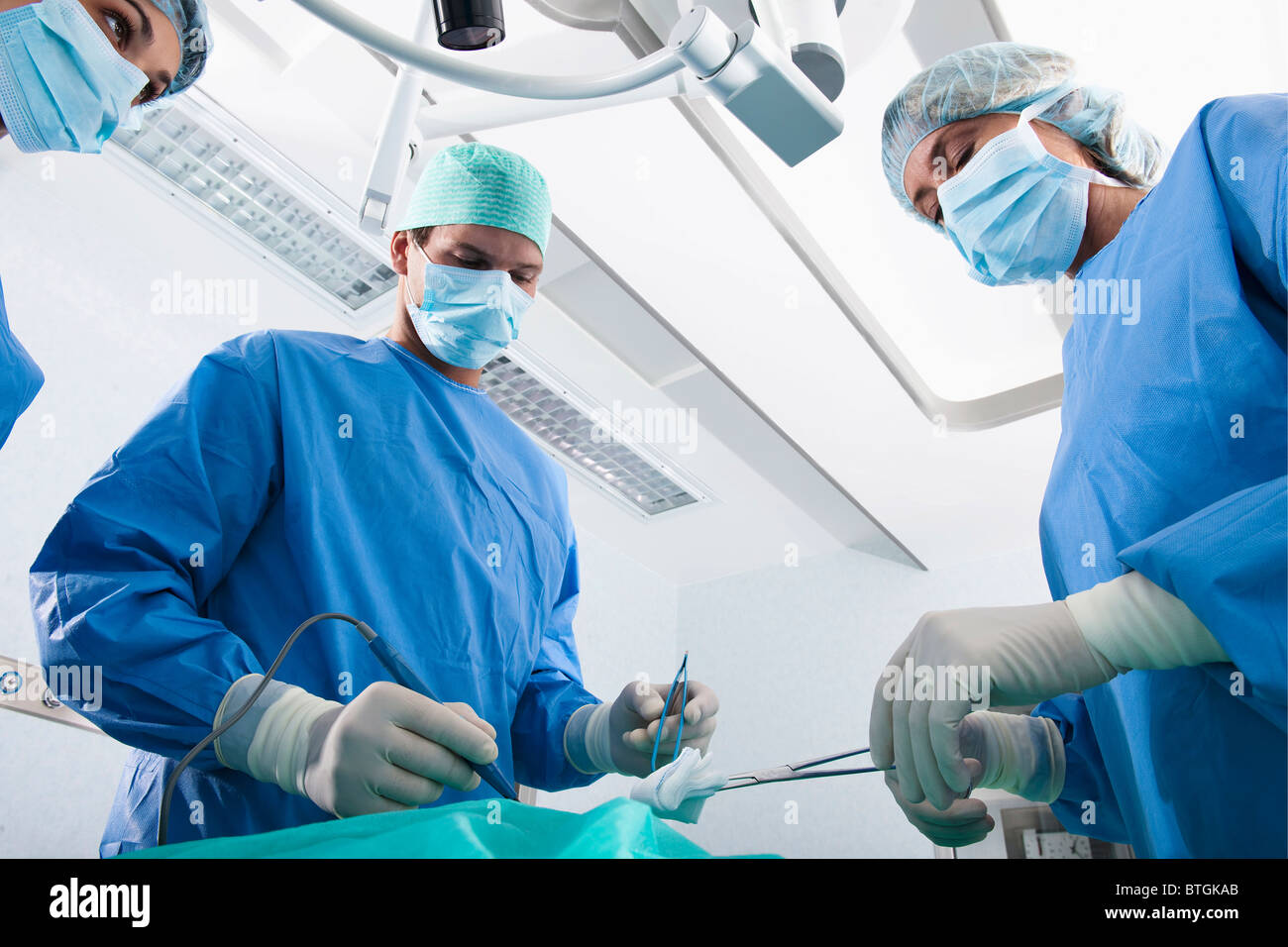 Medical personnel in operating room Stock Photo - Alamy