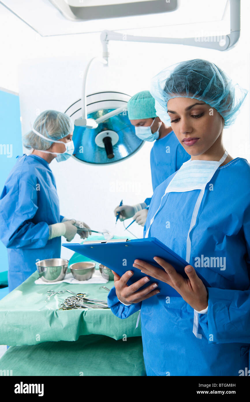 Medical personnel in operating room Stock Photo - Alamy