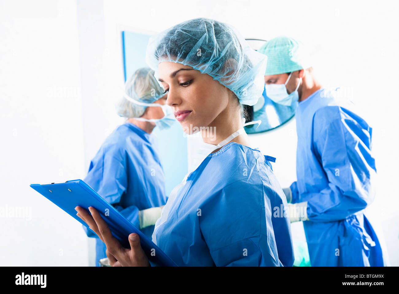 Medical personnel in operating room Stock Photo - Alamy
