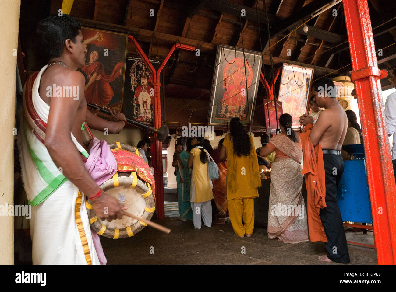 A man playing Thavil; a barrel shaped percussion instrument- Kali ...