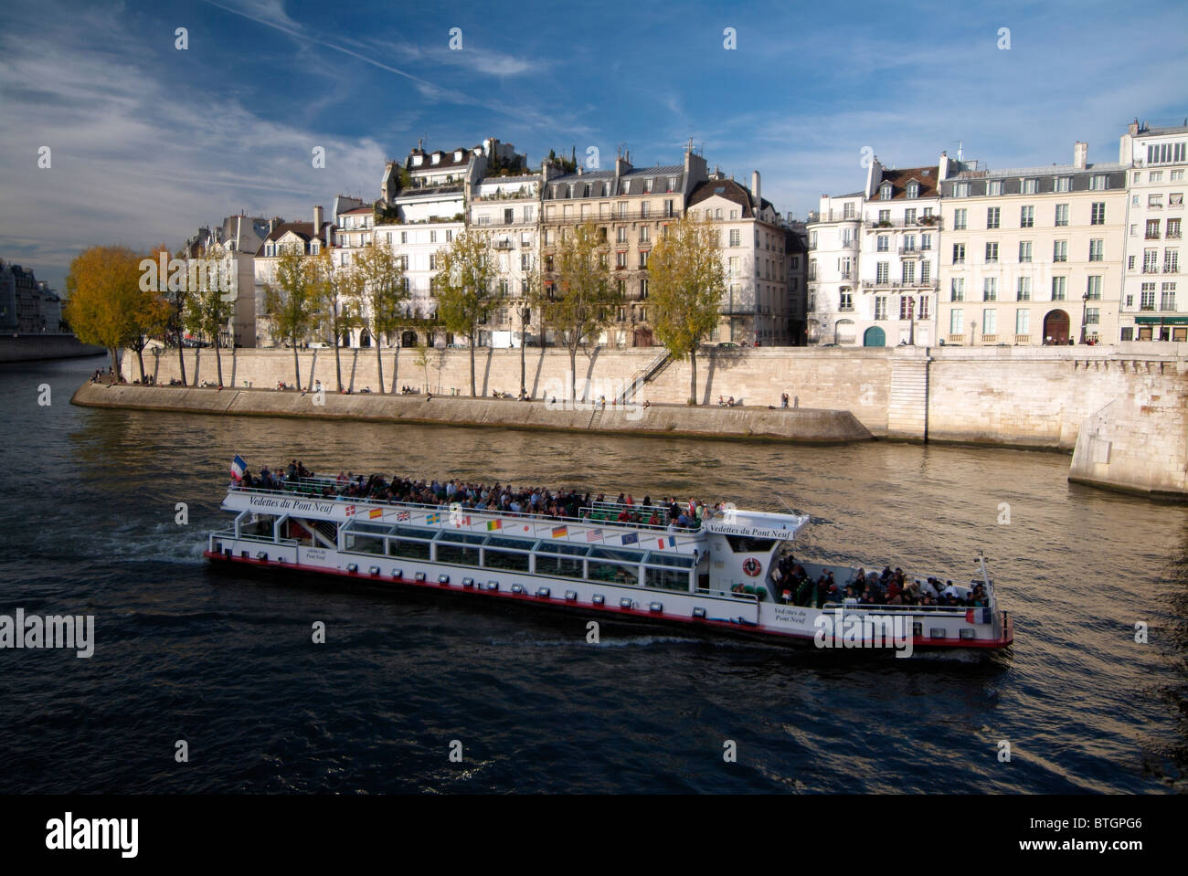 Bateau-mouche boat navigating on the Seine river, Paris, capital of ...