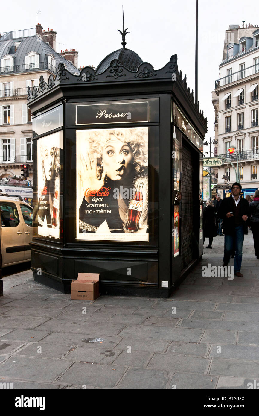 vintage old decorative cast iron newspaper kiosk with illuminated Coca ...