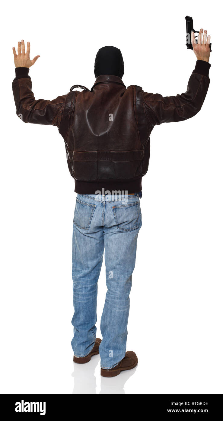 standing thief holding a gun isolated on white Stock Photo - Alamy