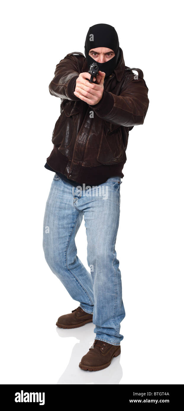 standing caucasian thief holding a gun isolated on white Stock Photo ...