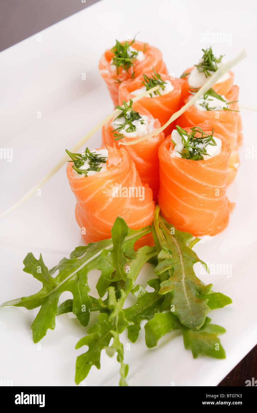 Smoked salmon rolls with cream cheese Stock Photo - Alamy