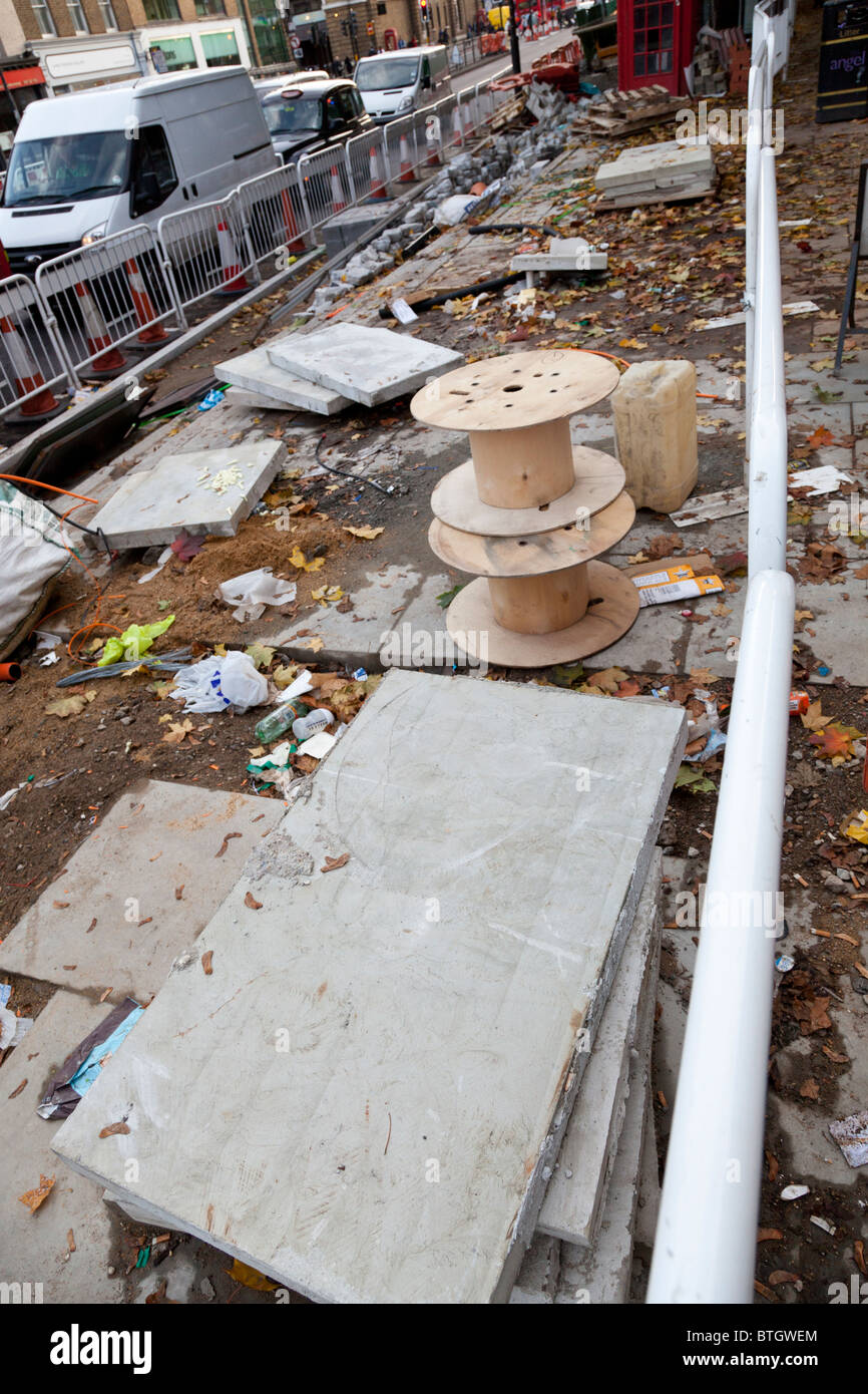 Repair materials and rubbish on the pavement in London, England Stock ...