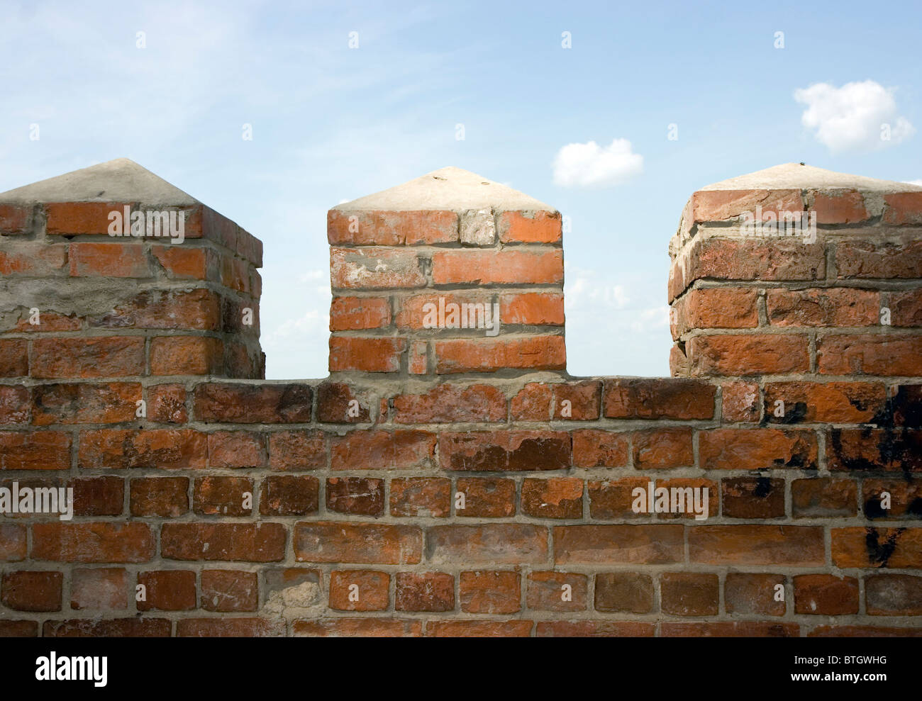 Photo of an ancient fence from a red brick Stock Photo - Alamy