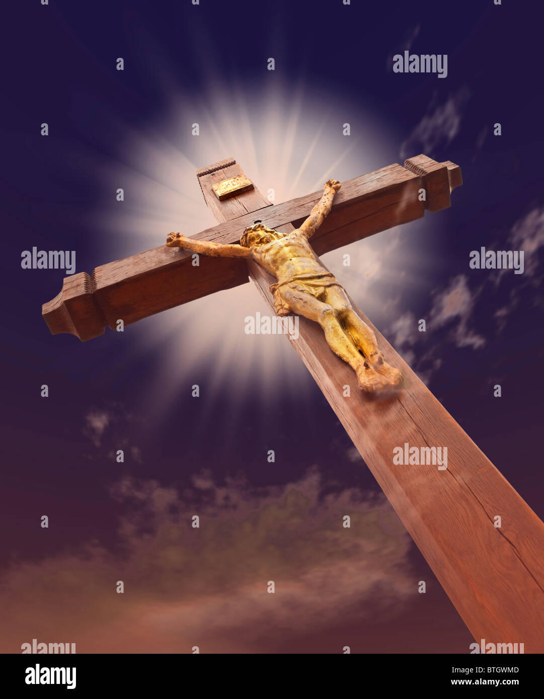 The crucifixion from a tree with Jesus's gilt figure. Drame sky Stock ...