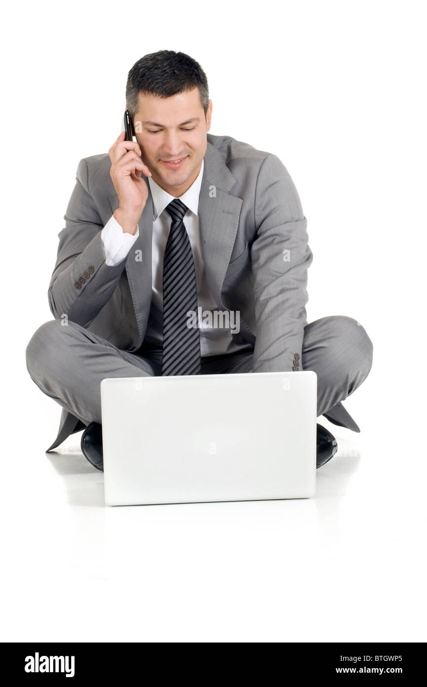 Young man phone laptop Cut Out Stock Images & Pictures - Alamy