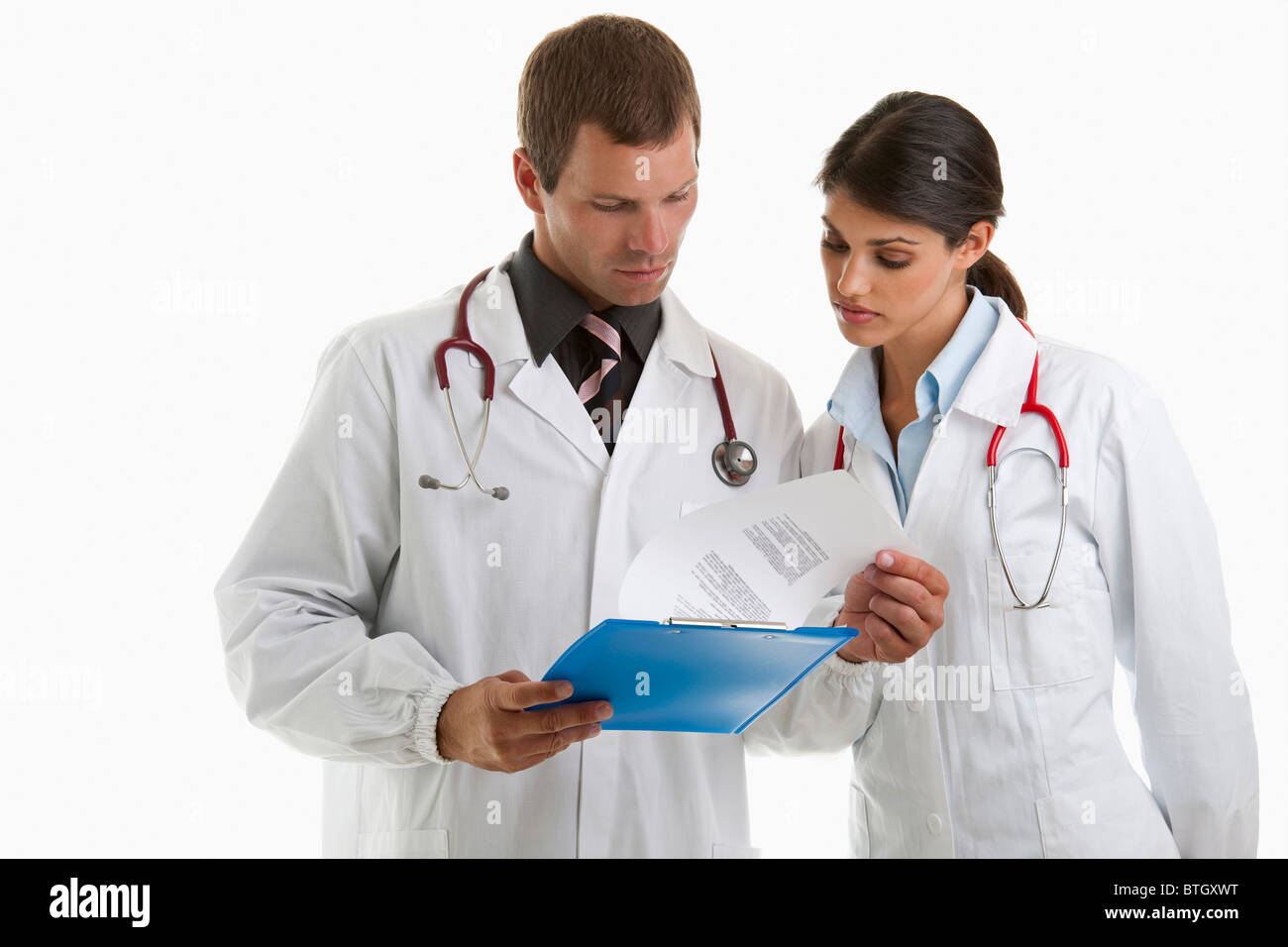 Two doctors looking at medical chart Stock Photo - Alamy