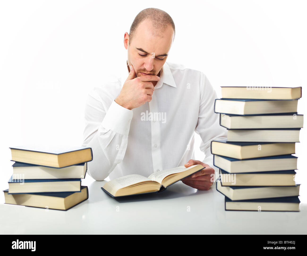 young caucasian man reading a book isolated on white Stock Photo - Alamy