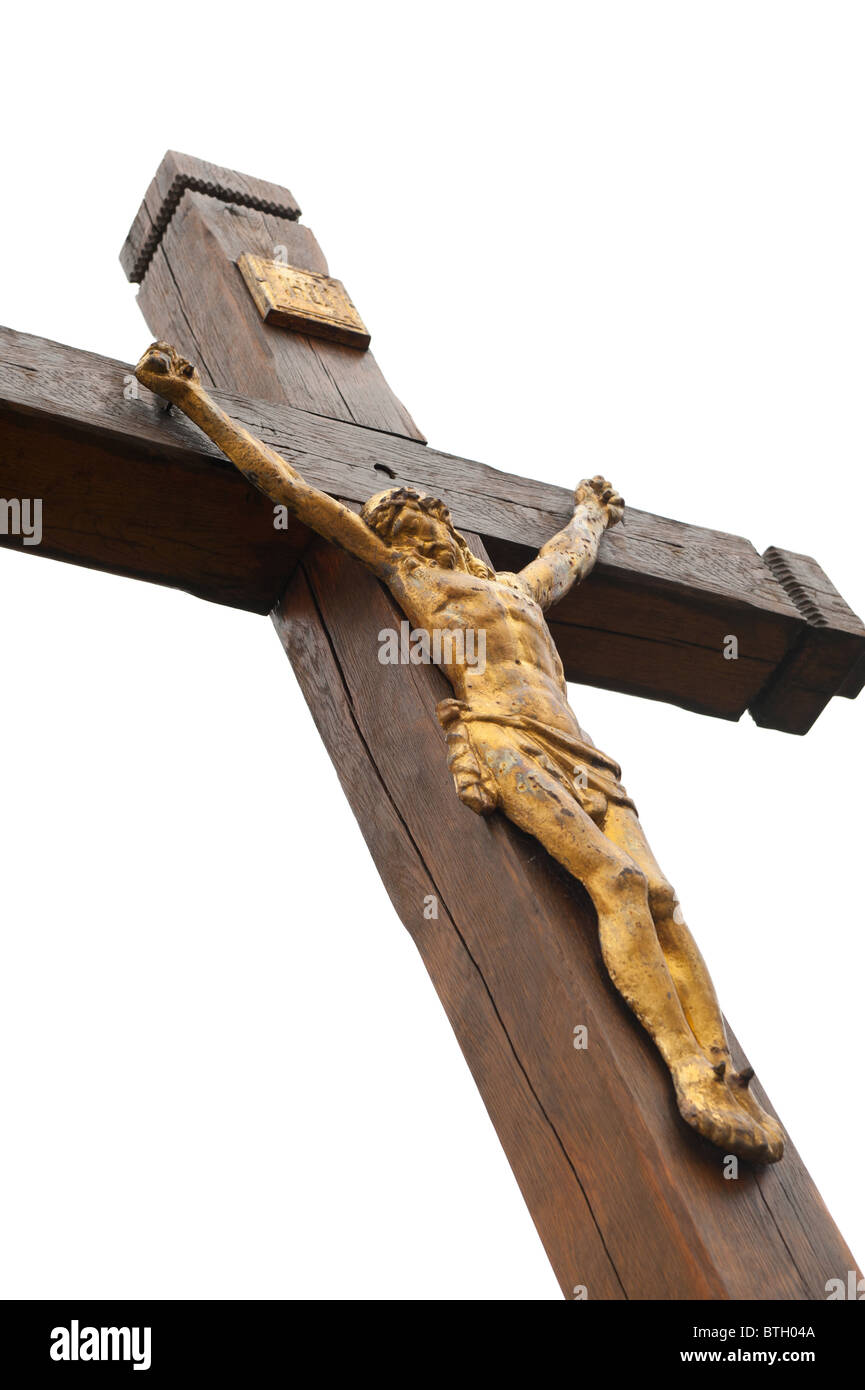 The crucifixion from a tree with Jesus's gilt figure. It is isolated on ...