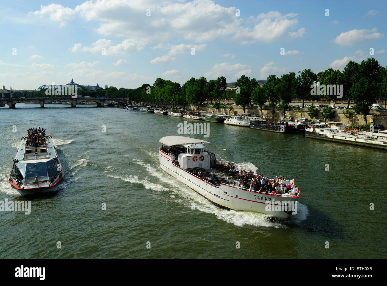Bateau-mouche boat navigating on the Seine river, Paris, capital of ...