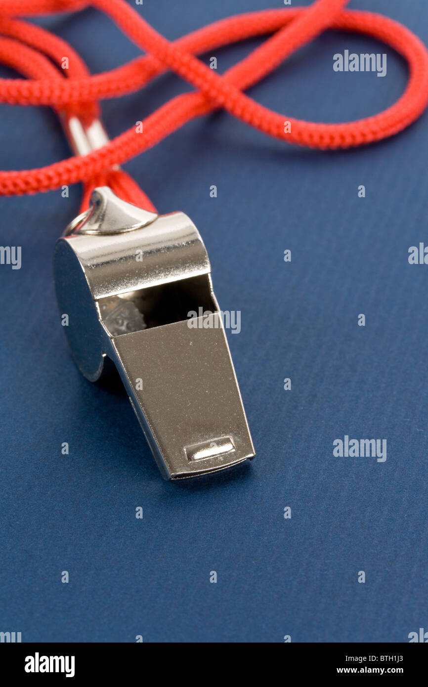 a whistle with blue background Stock Photo - Alamy