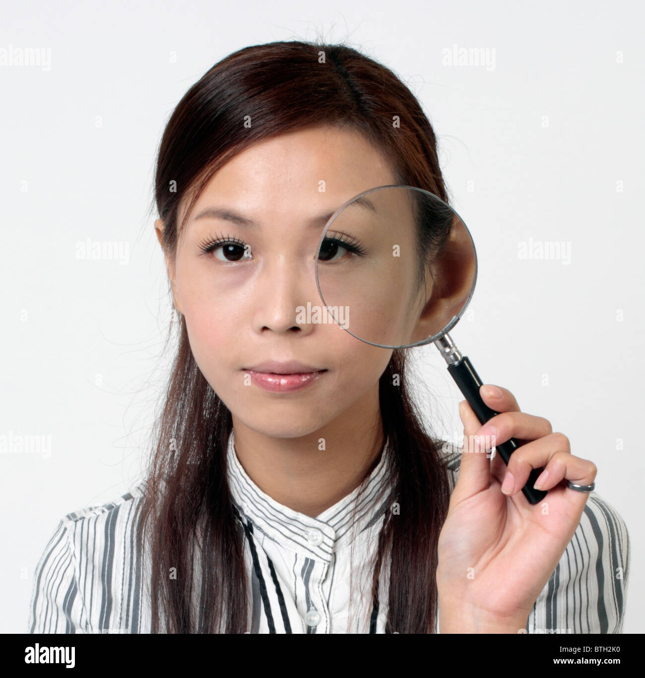 Office lady plays magnifier Stock Photo - Alamy