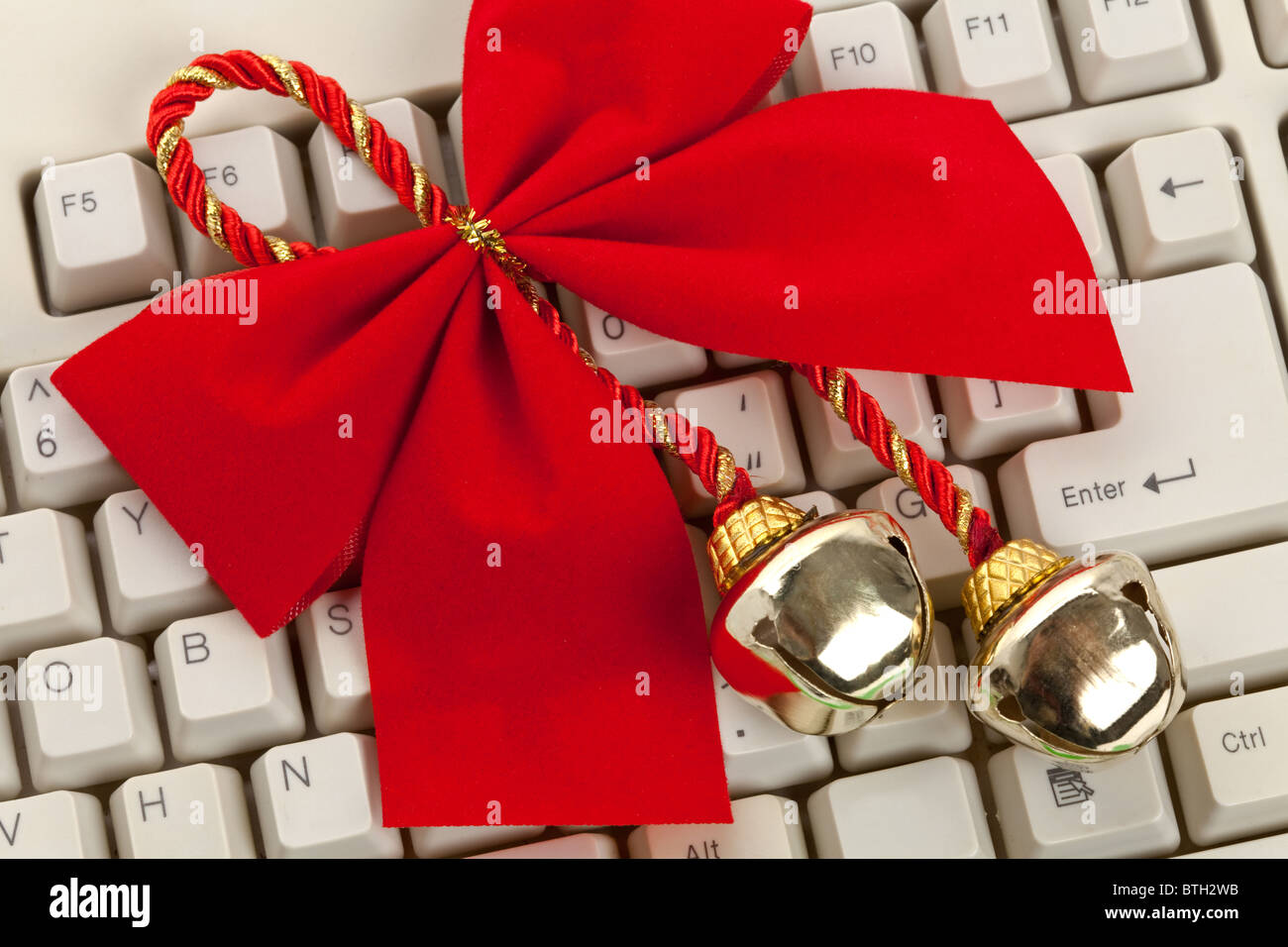 Christmas Bells, ribbon and computer keyboard Stock Photo - Alamy