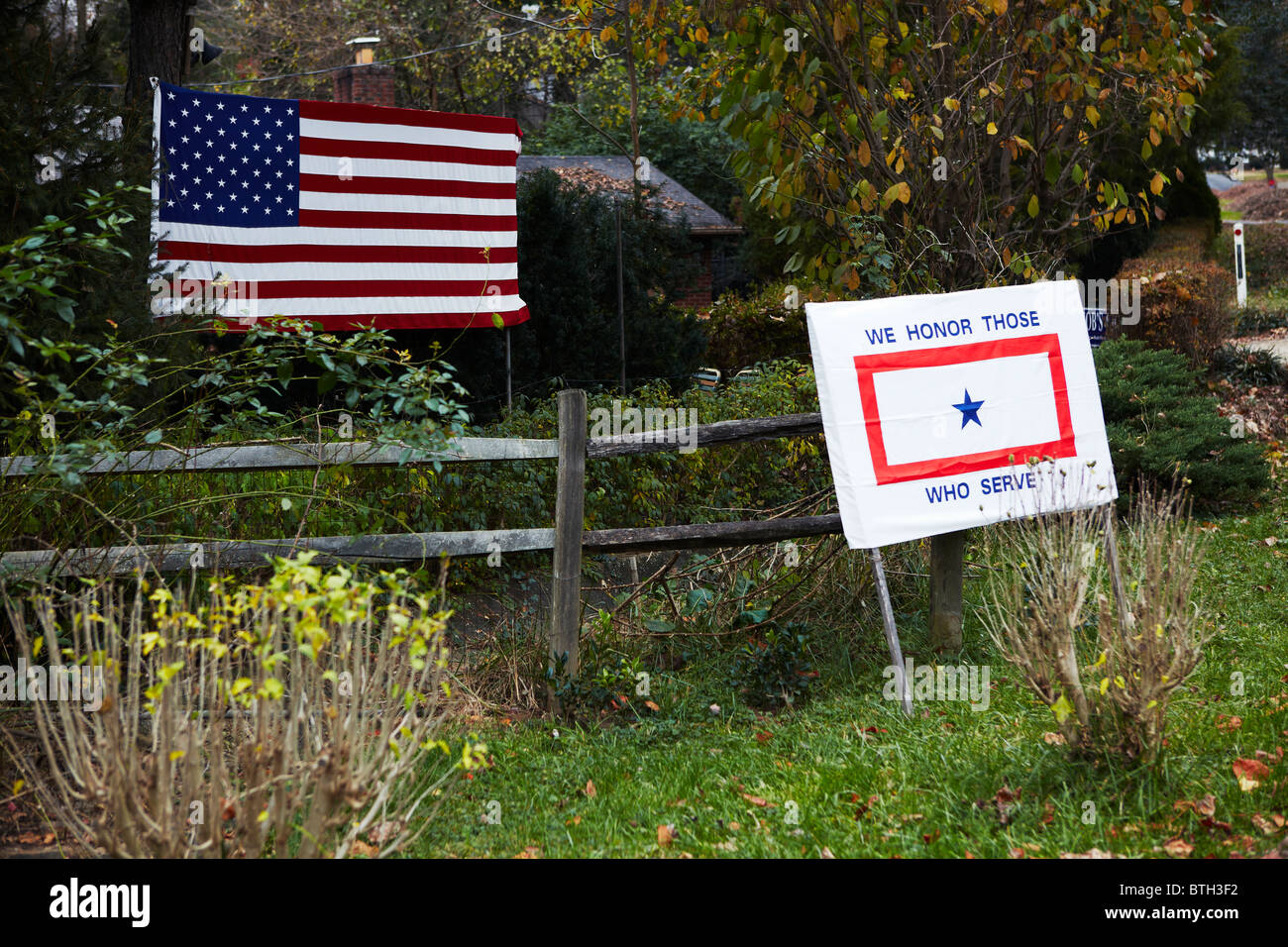 American flag in front house hi-res stock photography and images - Alamy