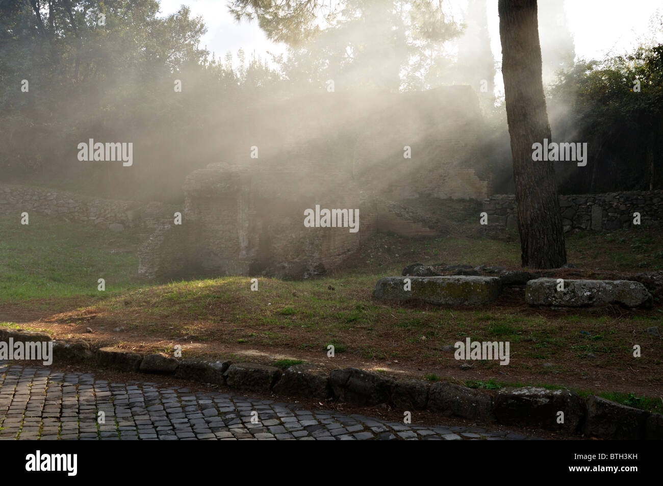 View of Appian Way with smoke revealing rays of light, late afternoon ...