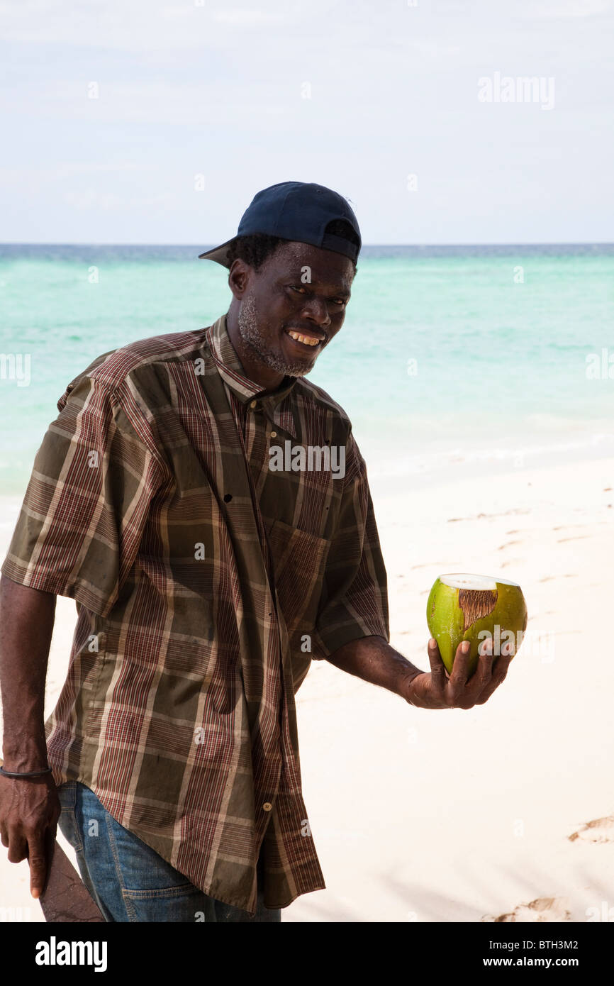 Local black man in Barbados selling fresh coconut milk on a beach Stock ...