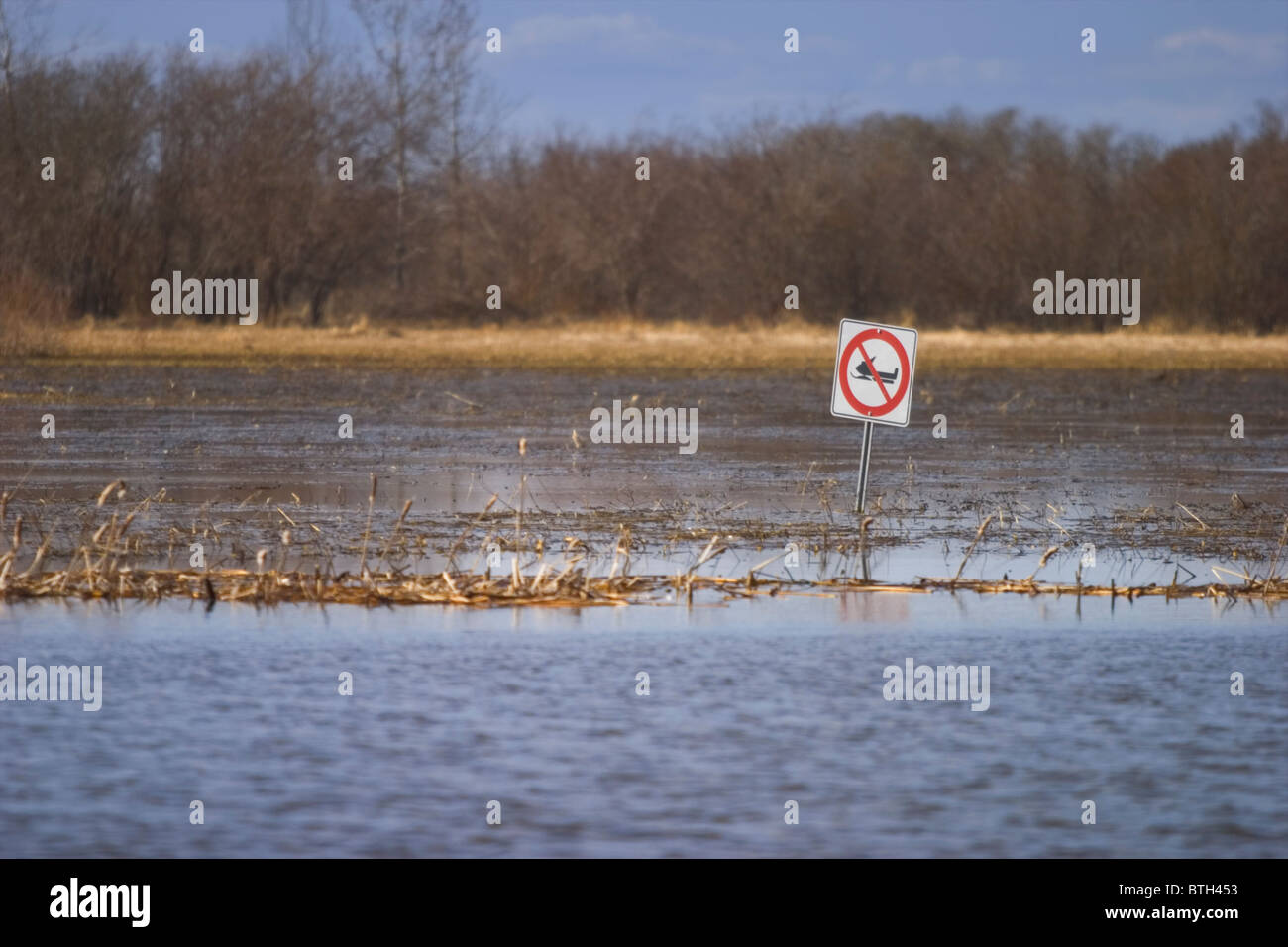 No snowmobiling sign in spring river Stock Photo - Alamy